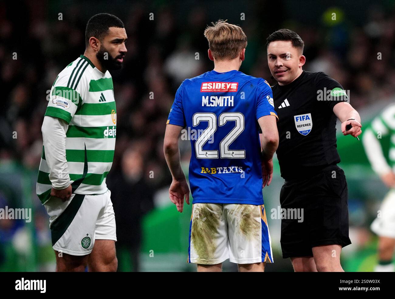 Referee Matthew MacDermid speaks with the captains of both sides, St ...