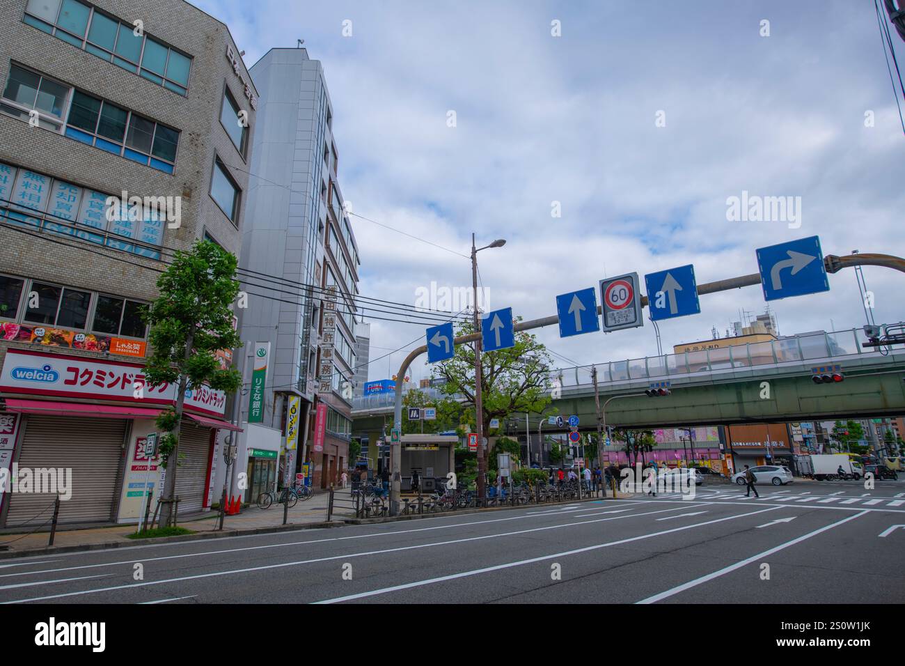 Modern commercial buildings on Sakai suji Avenue at Sennichimae-dori ...