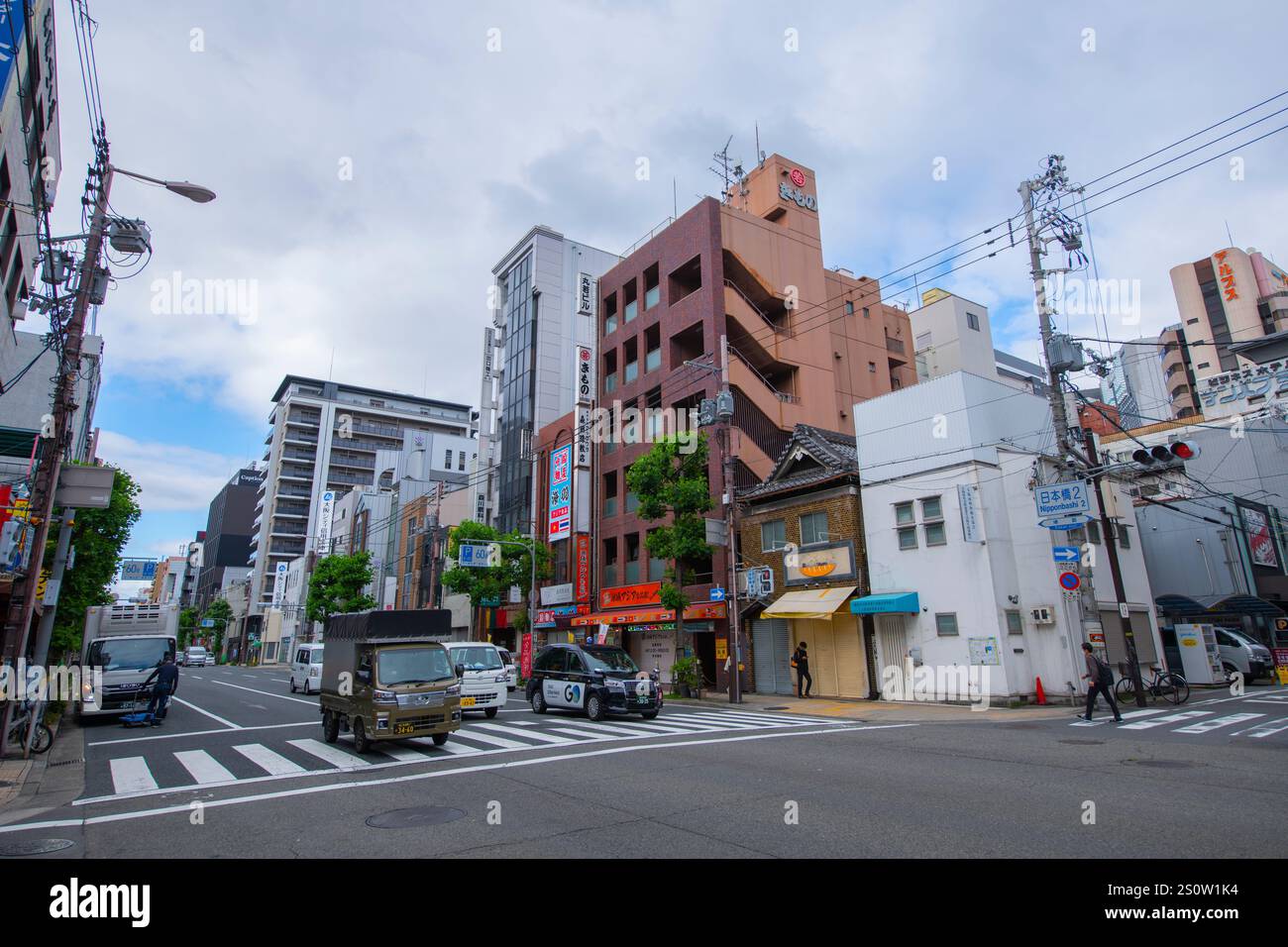 Modern commercial buildings on Sakai suji Avenue at Nipponbashi in ...
