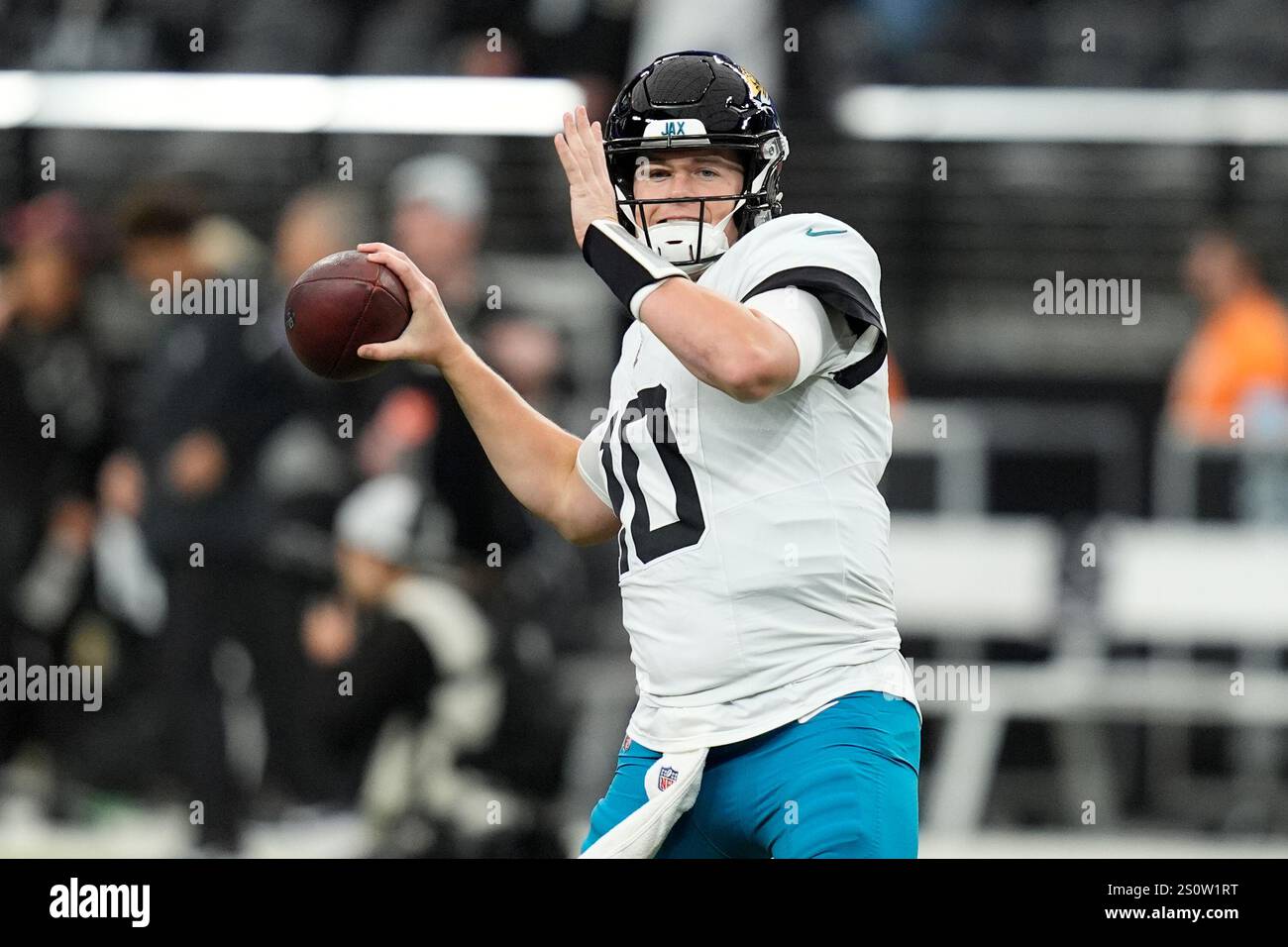 Jacksonville Jaguars quarterback Mac Jones (10) warms up before an NFL ...