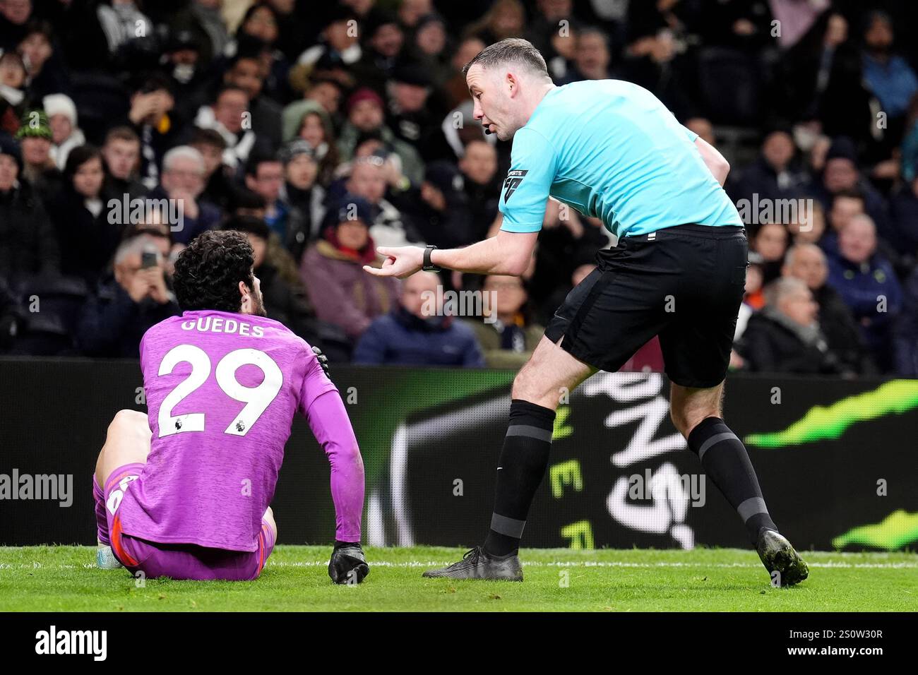 Wolverhampton Wanderers' Goncalo Guedes (left) is told by referee Chris ...