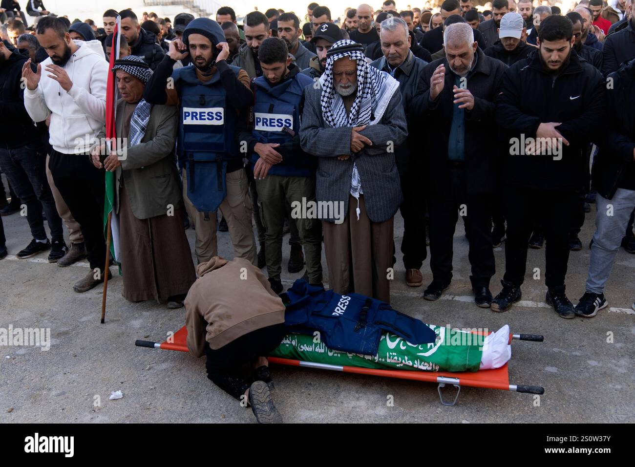 Palestinians hold the funeral prayers over the body of Shatha al-Sabbagh, a 22-year-old ...