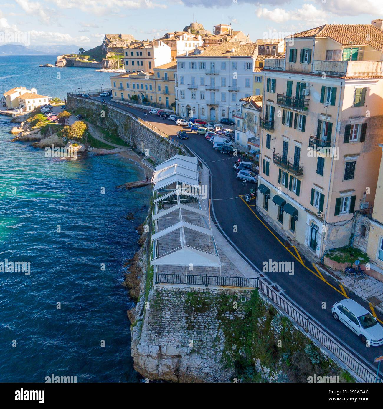 Coastal town with seaside buildings and a curving road Stock Photo - Alamy