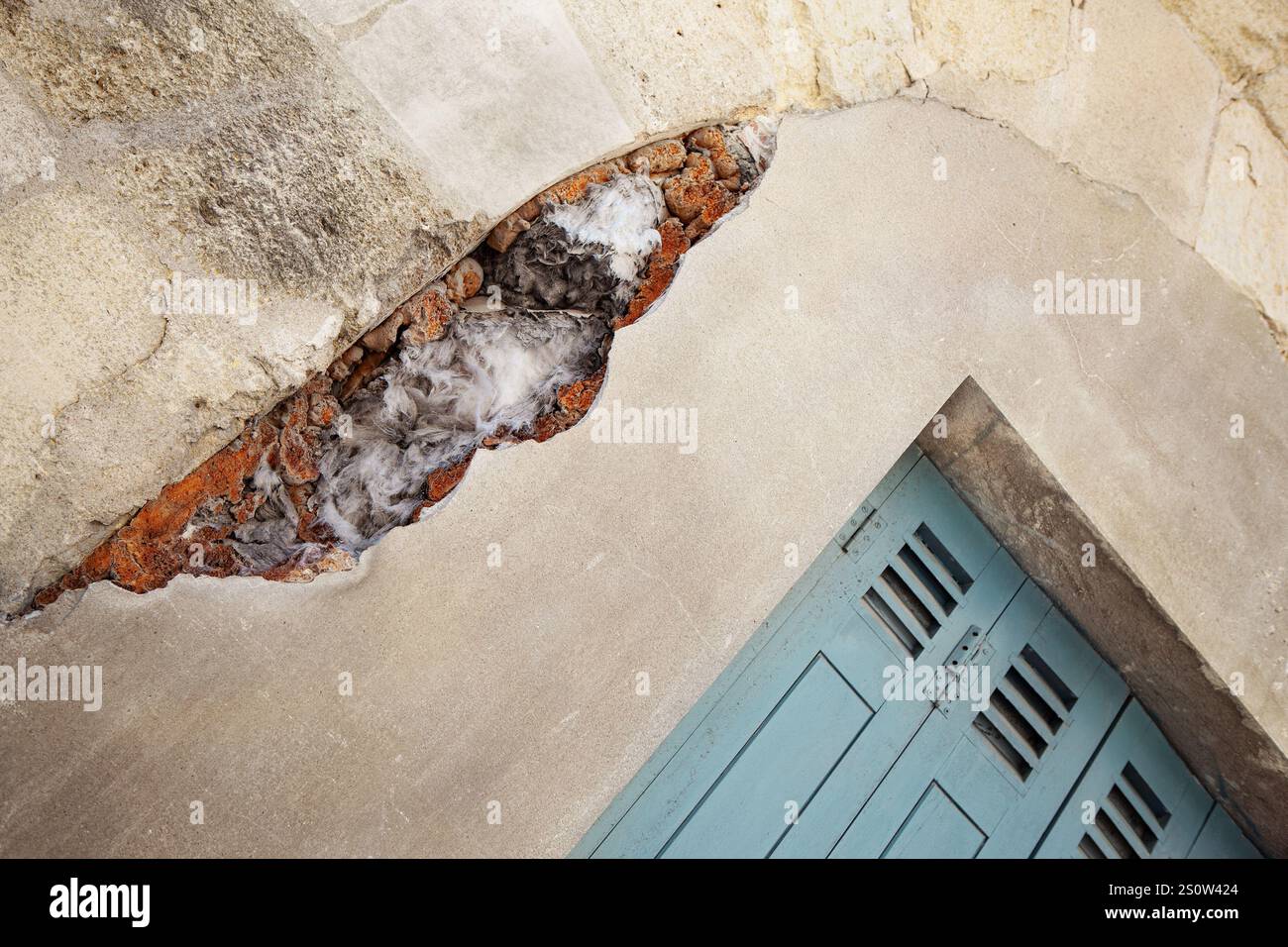 Old wool insulation in a concrete wall Stock Photo - Alamy