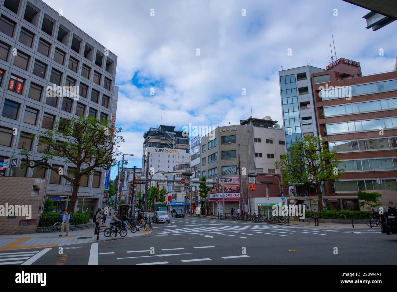 Modern commercial buildings on Sakai suji Avenue at Sennichimae-dori ...