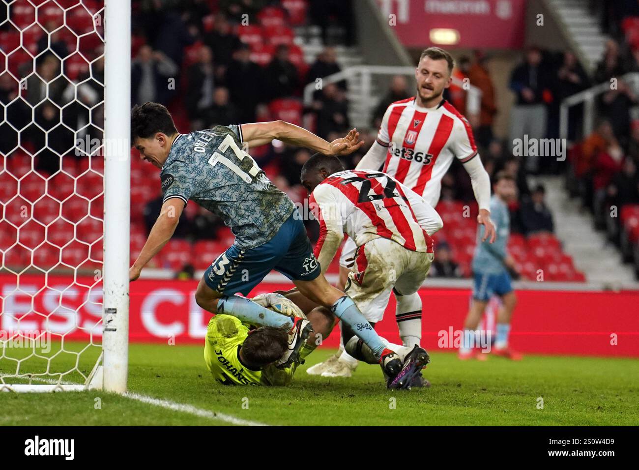 Sunderland's Luke O'Nien and Stoke City goalkeeper Viktor Johansson (on ...