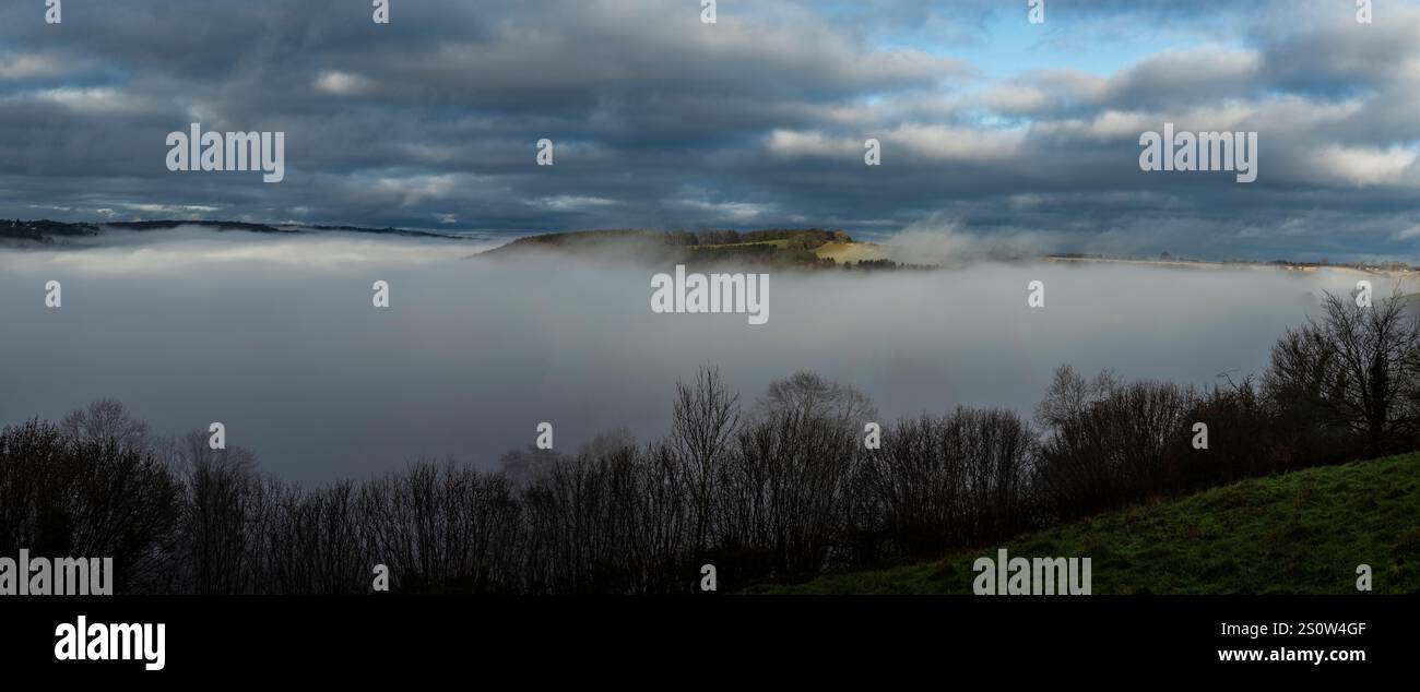 Dragon's breath and Mocking Hazel Wood. Mist in the Wye Valley, Wales ...