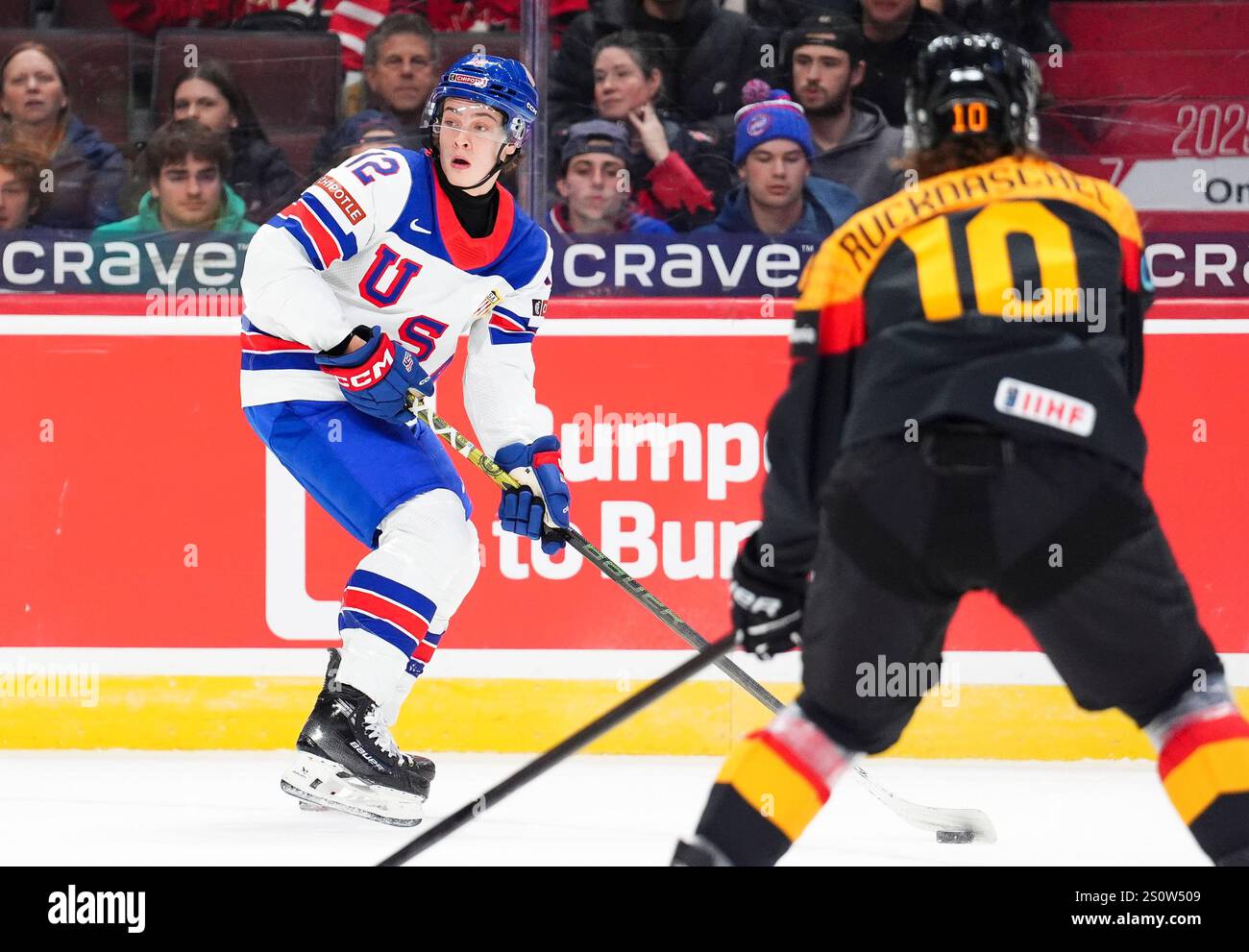 Ottawa, Canada. 26th Dec, 2024. USA's James Hagens (12) looks for a ...