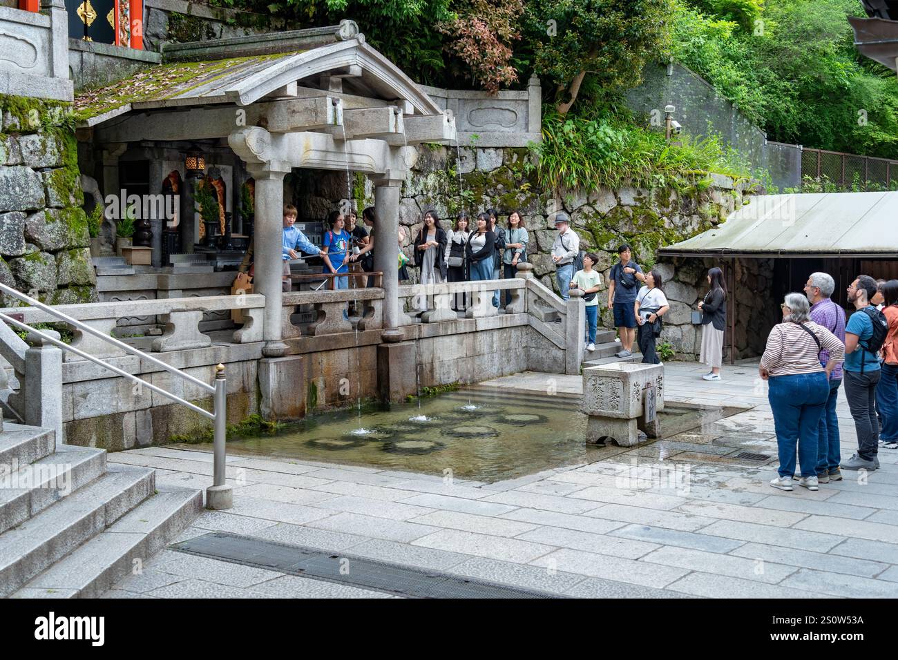 Kyoto, Japan - 05.07.2024: People standing in line at the purification ...