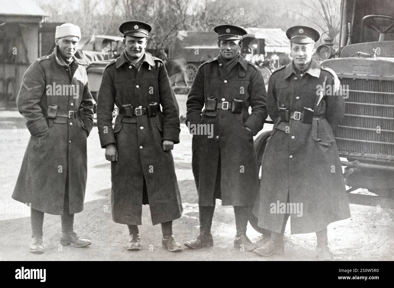 Drivers of the Army Service Corps next to a bus from the London General Omnibus Company (LGOC ...