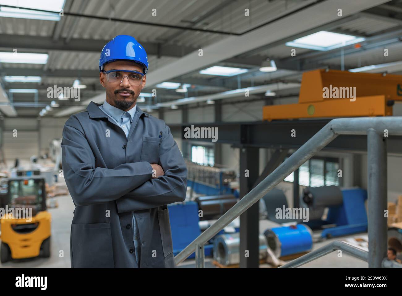 African American engineer in industrial warehouse. Diversity concept ...