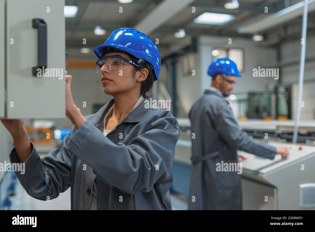 Multiracial engineer team, African American man and Indian woman ...
