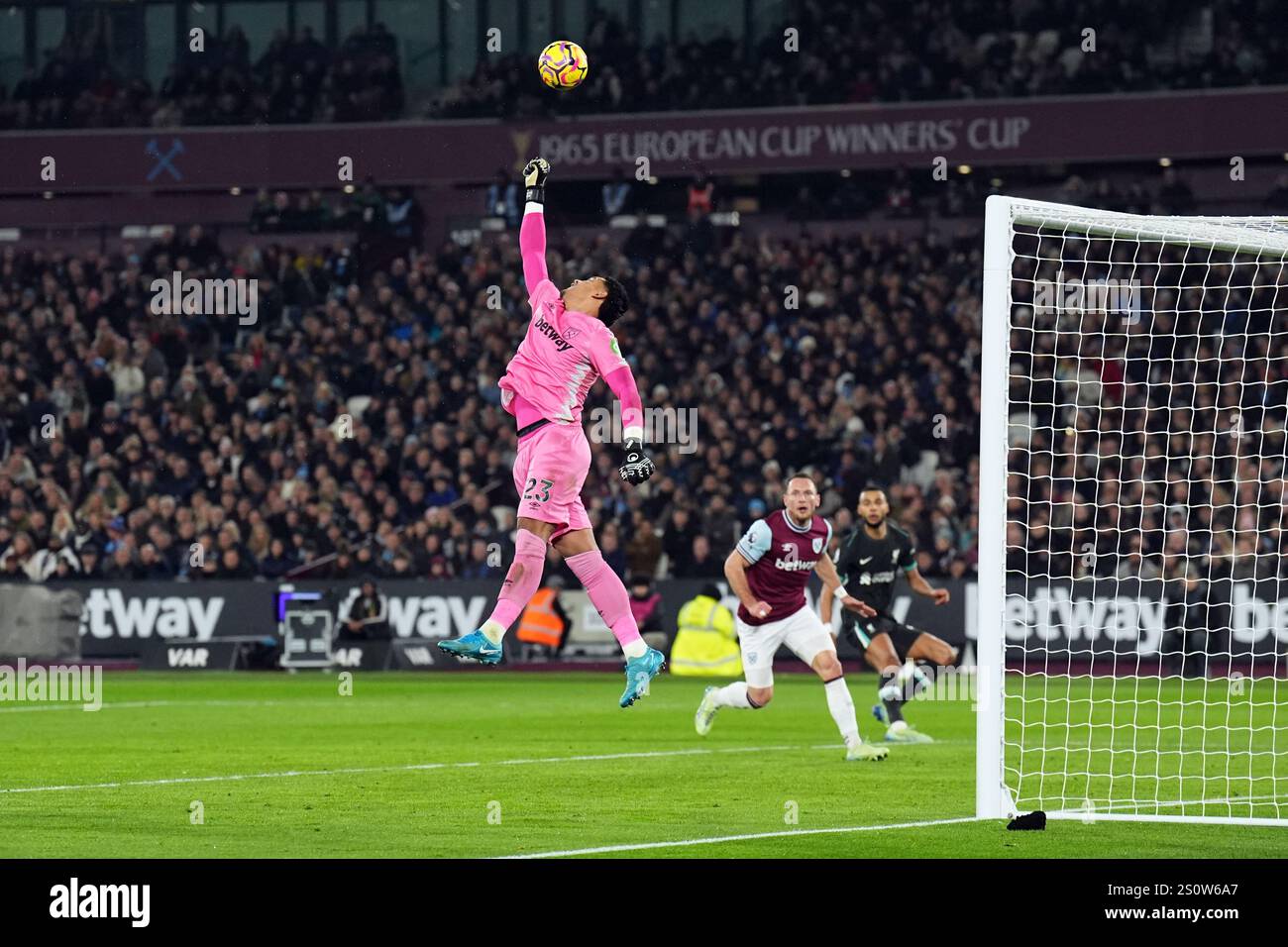 West Ham United goalkeeper Alphonse Areola attempts to clear a cross ...