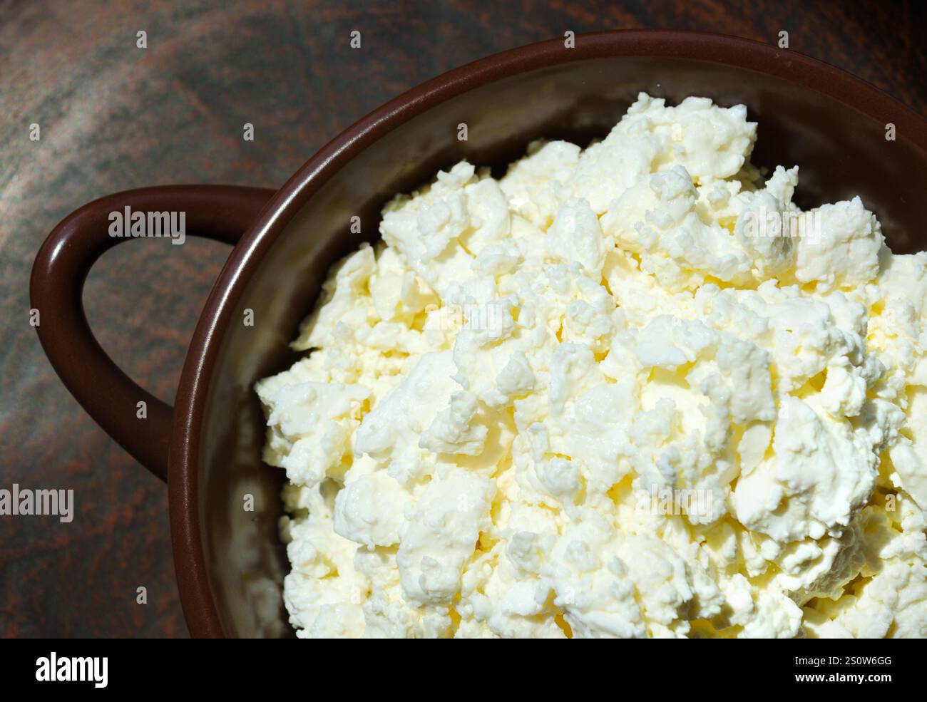 Cottage cheese in a ceramic bowl. Delicious grainy homemade cottage ...