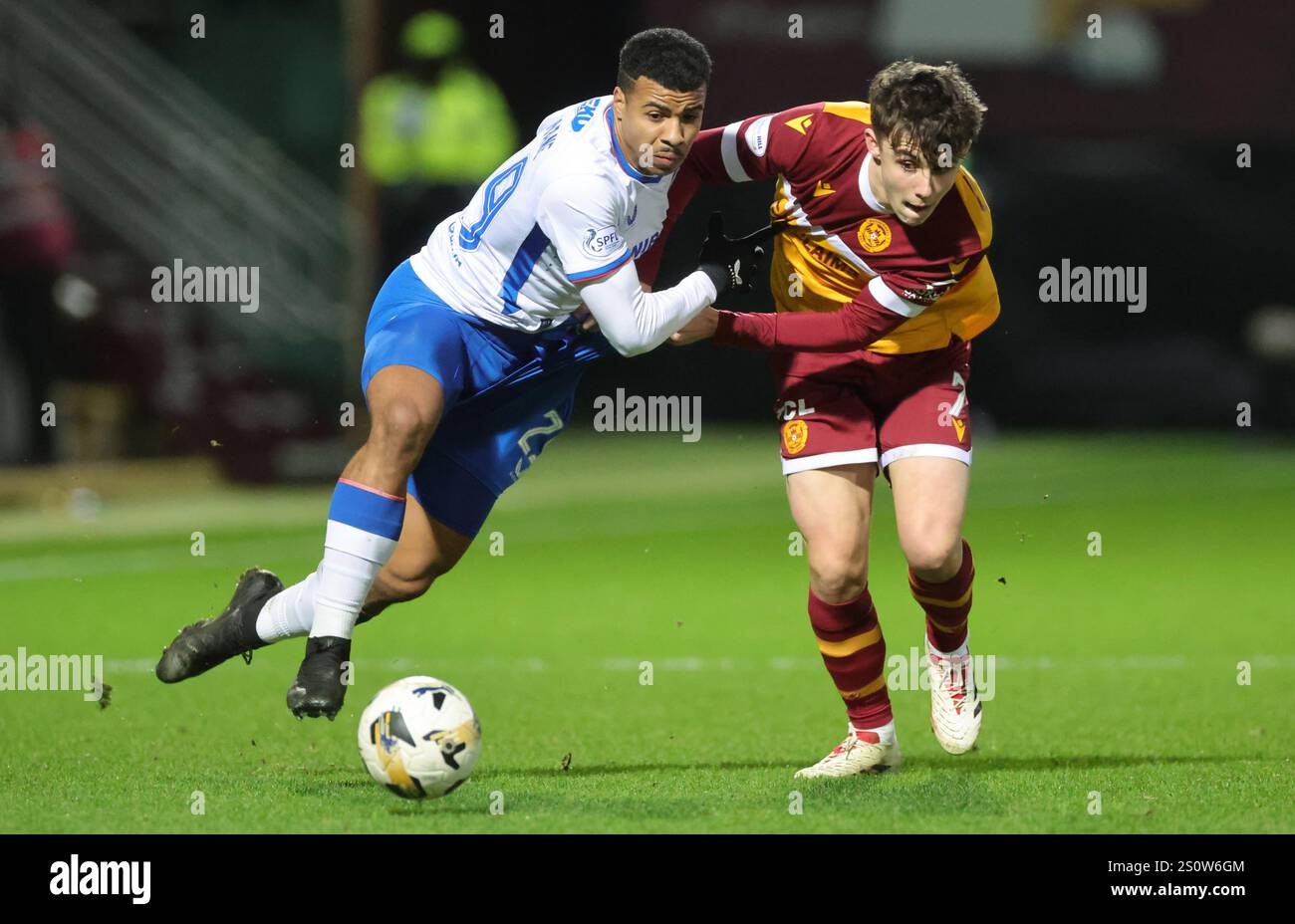 Motherwell's Tom Sparrow holds of Rangers' Danilo during the William ...