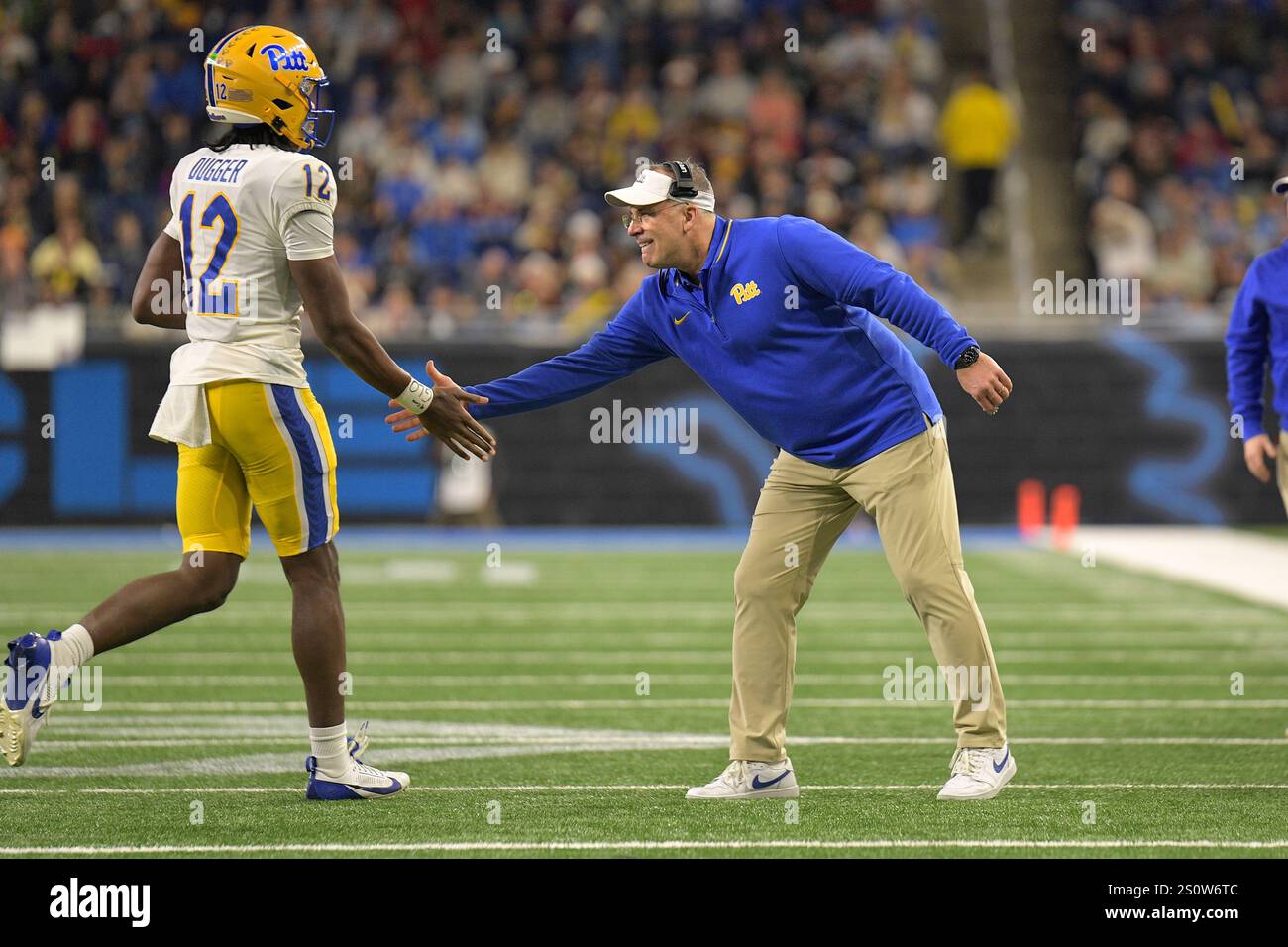 DETROIT, MI - DECEMBER 26: Pittsburgh Panthers head coach Pat Narduzzi gives a low-five to ...