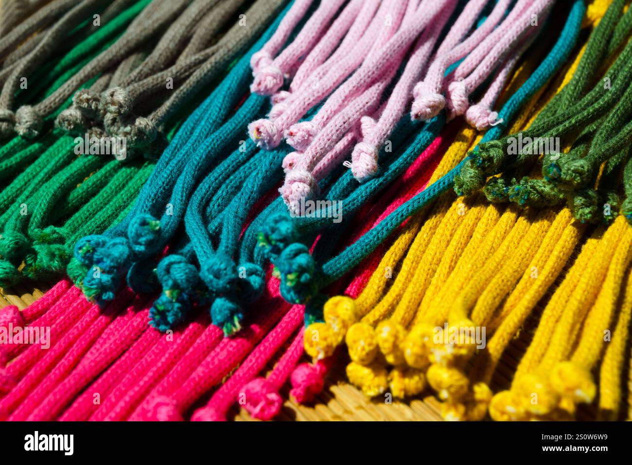 Multi-colored knots on the yarn. Turkish yarn for weaving macrame Stock ...