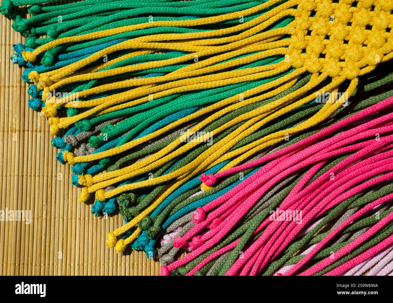 Multi-colored knots on the yarn. Turkish yarn for weaving macrame Stock ...