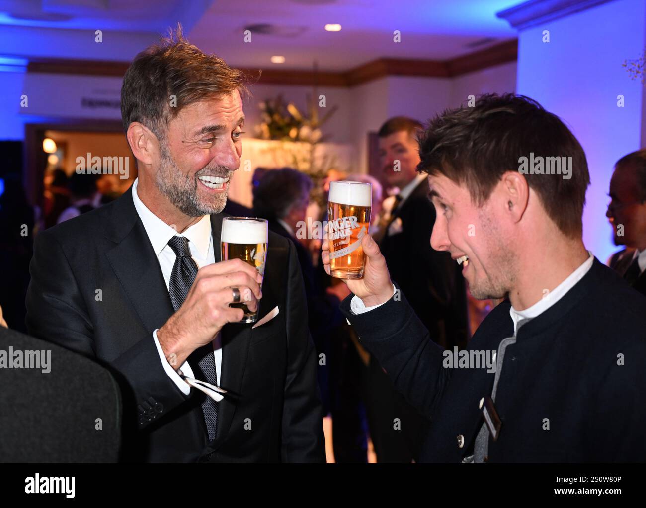 Munich, Germany. 29th Dec, 2024. Jürgen Klopp (l) talks to a guest at ...