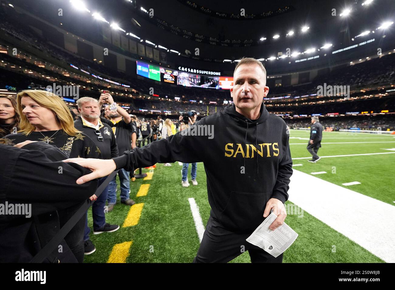 New Orleans Saints interim head coach Darren Rizzi talks with fans ...