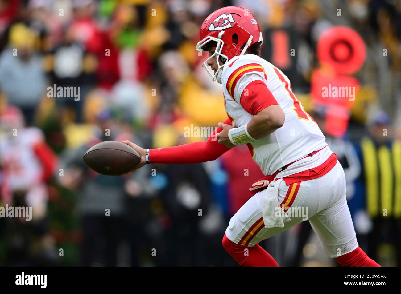Kansas City Chiefs quarterback Patrick Mahomes turns to hand off during ...