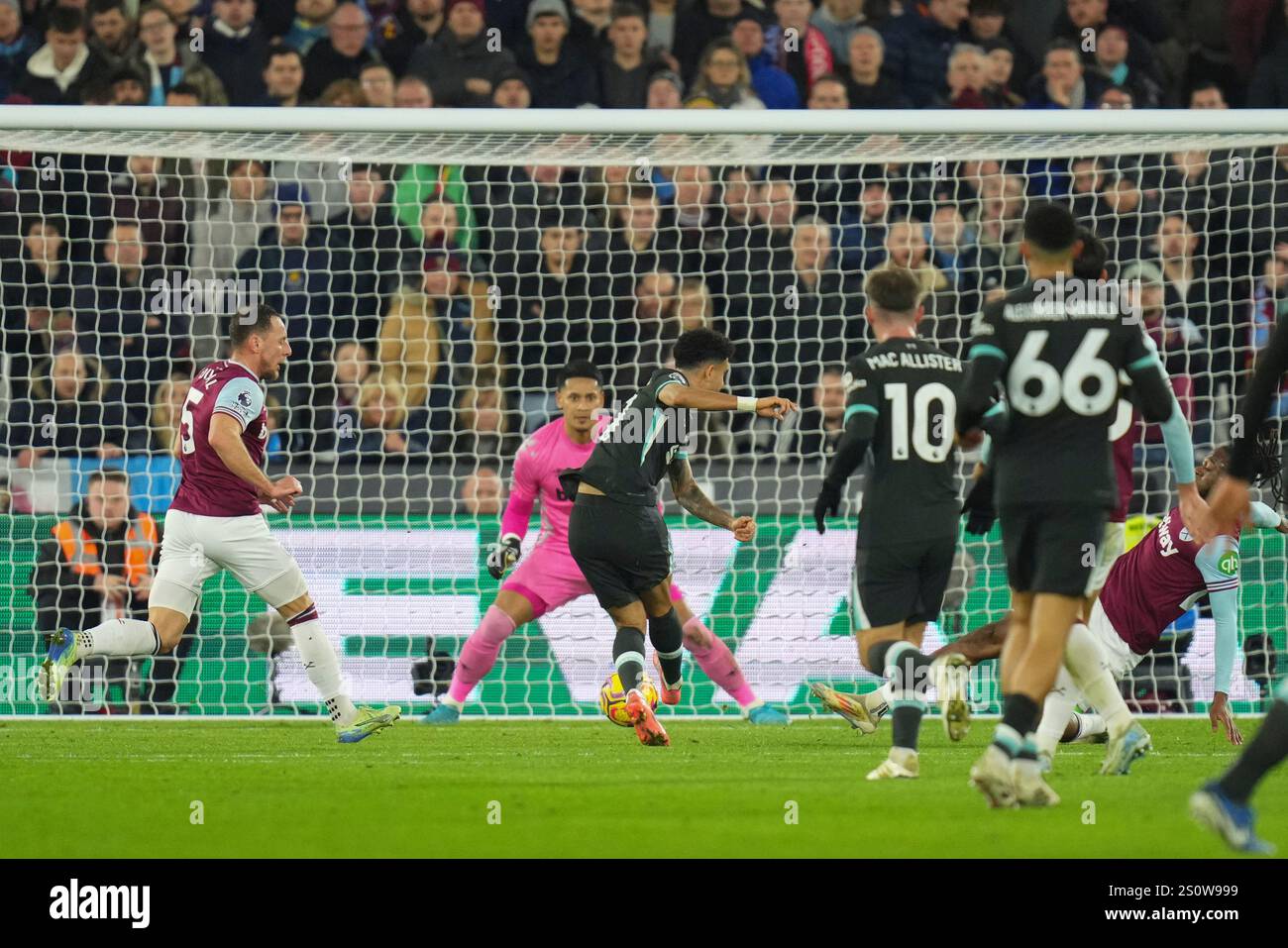 Liverpool's Luis Diaz, center, shoots to score the opening goal during the English Premier ...