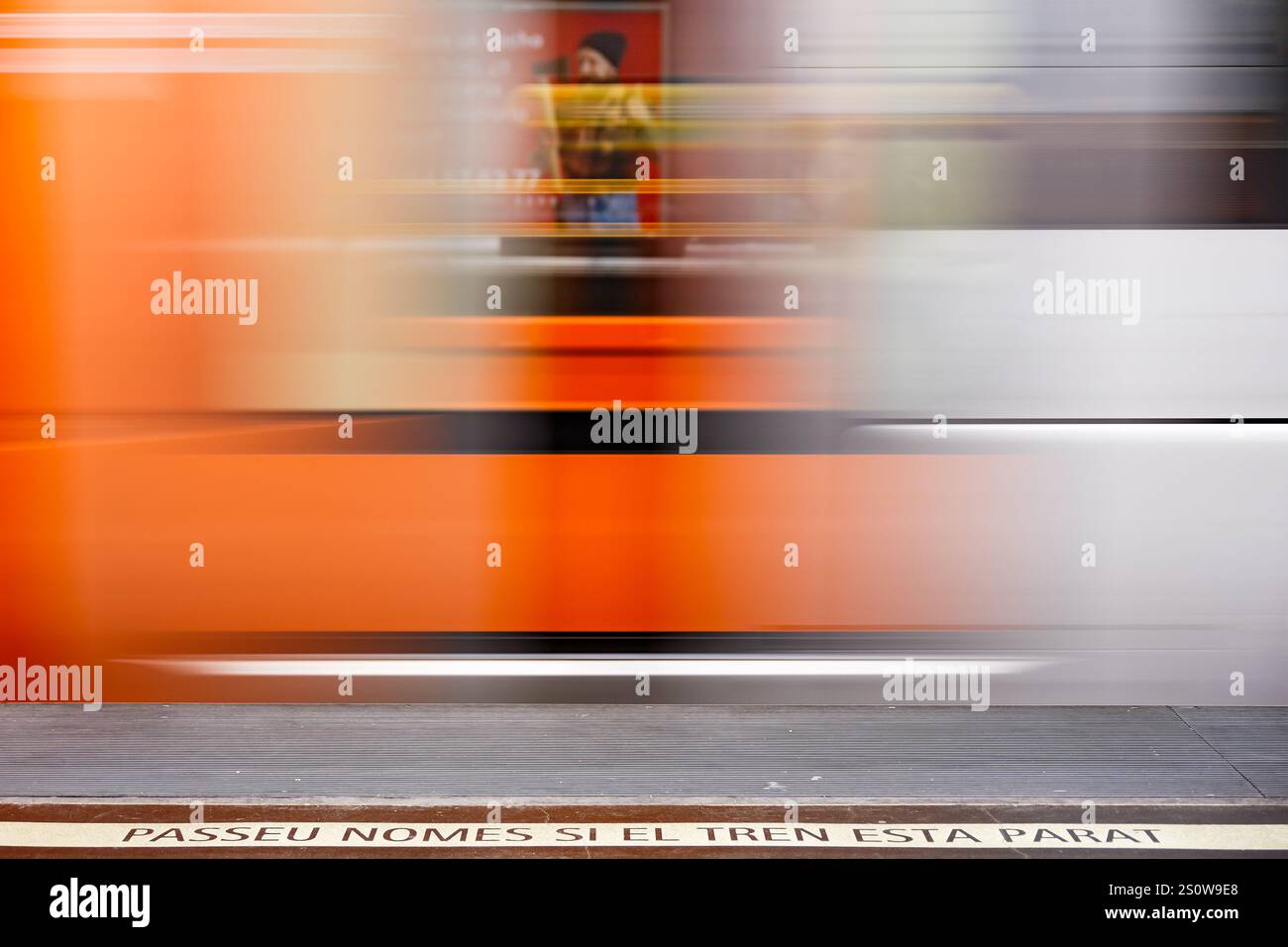 The moving train with a warning sign Stock Photo - Alamy