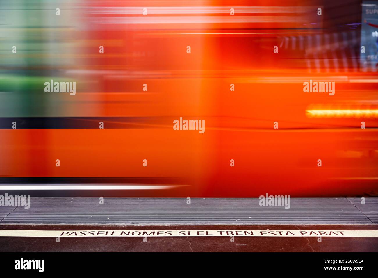 The moving train with a warning sign Stock Photo - Alamy