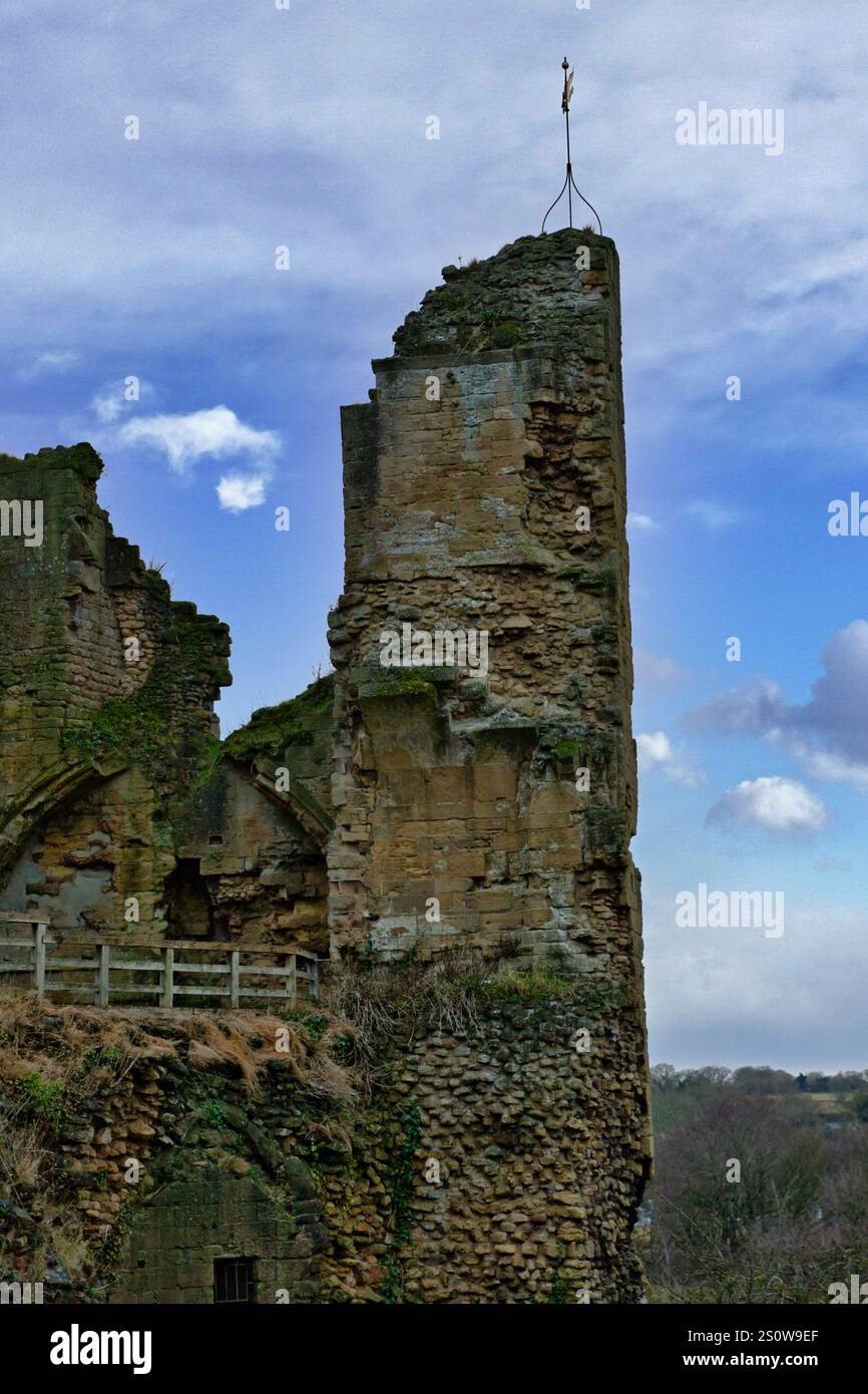 Partially ruined stone tower, showing significant weathering and ...