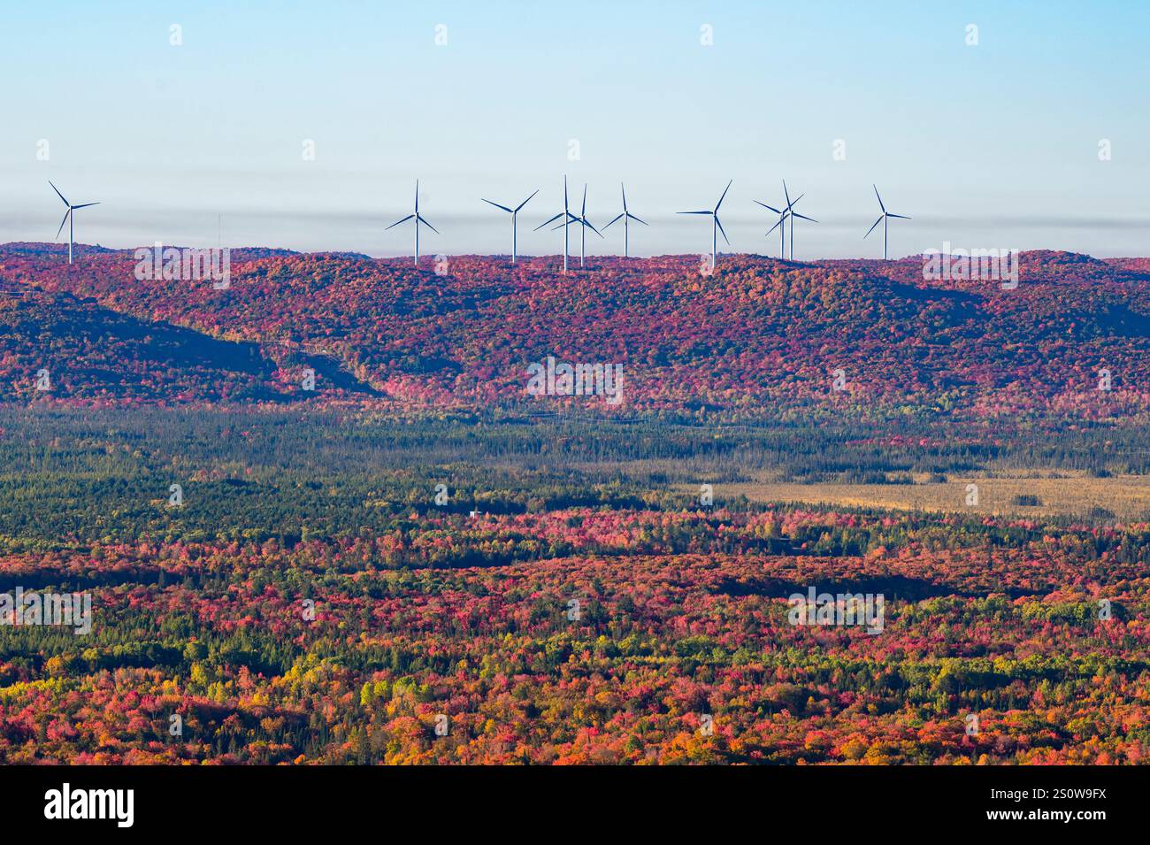 Ten Wind Turbines Amidst Vibrant Fall Foliage Producing Wind Power ...