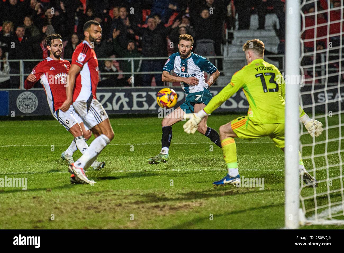 Morecambe FC's Gwion Edwards shoots across the goal mouth during the ...