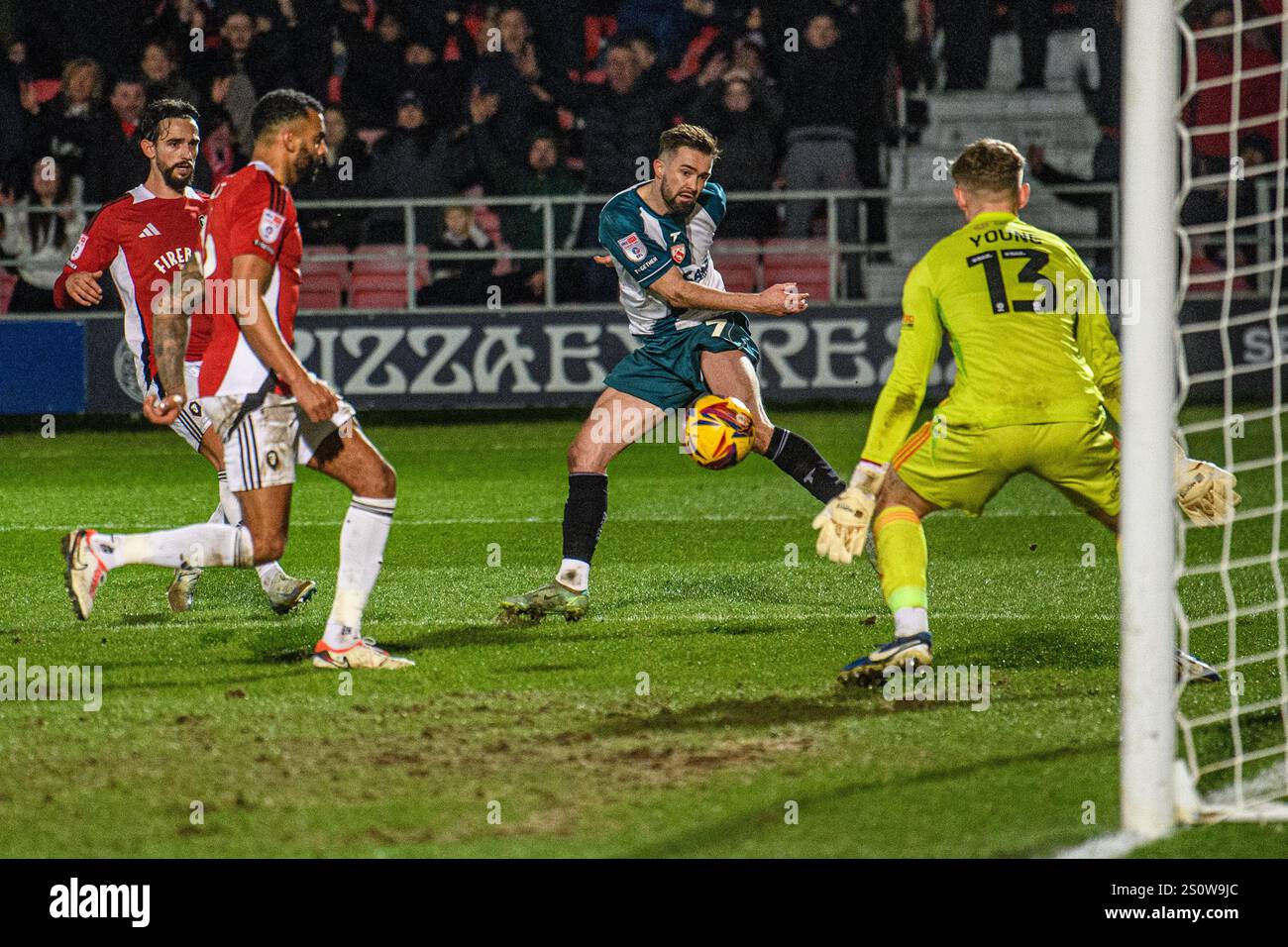 Morecambe FC's Gwion Edwards shoots across the goal mouth during the ...