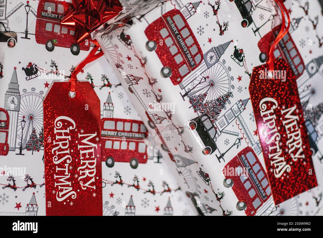 Close-up view of two Christmas gift packages wrapped in white paper ...