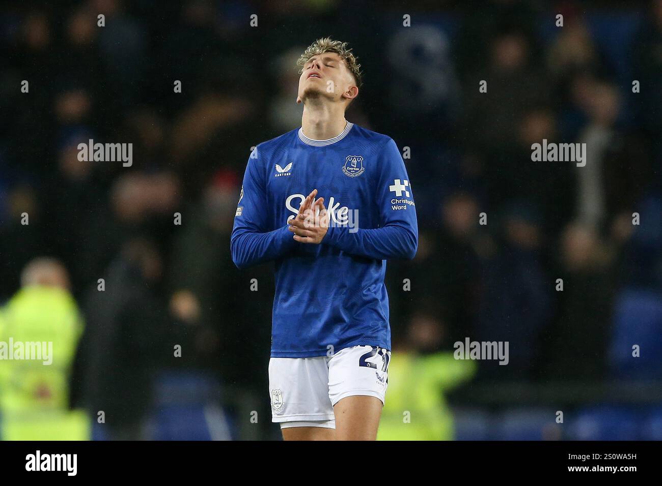 Jesper Lindstrom of Everton looking dejected as he shows his ...