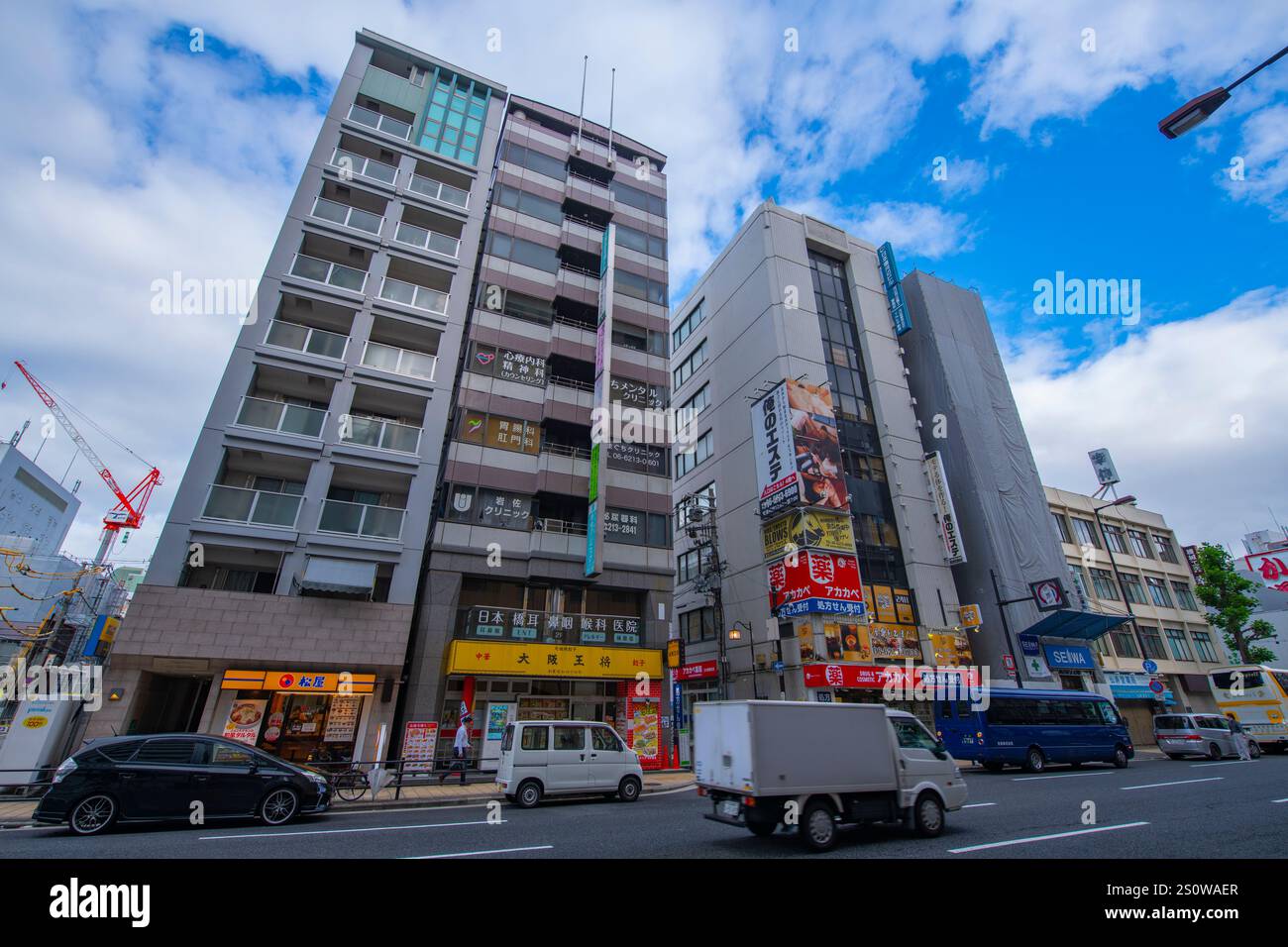 Modern commercial buildings on Sakai suji Avenue at Nipponbashi in ...