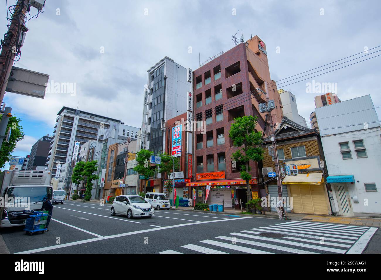 Modern commercial buildings on Sakai suji Avenue at Nipponbashi in ...