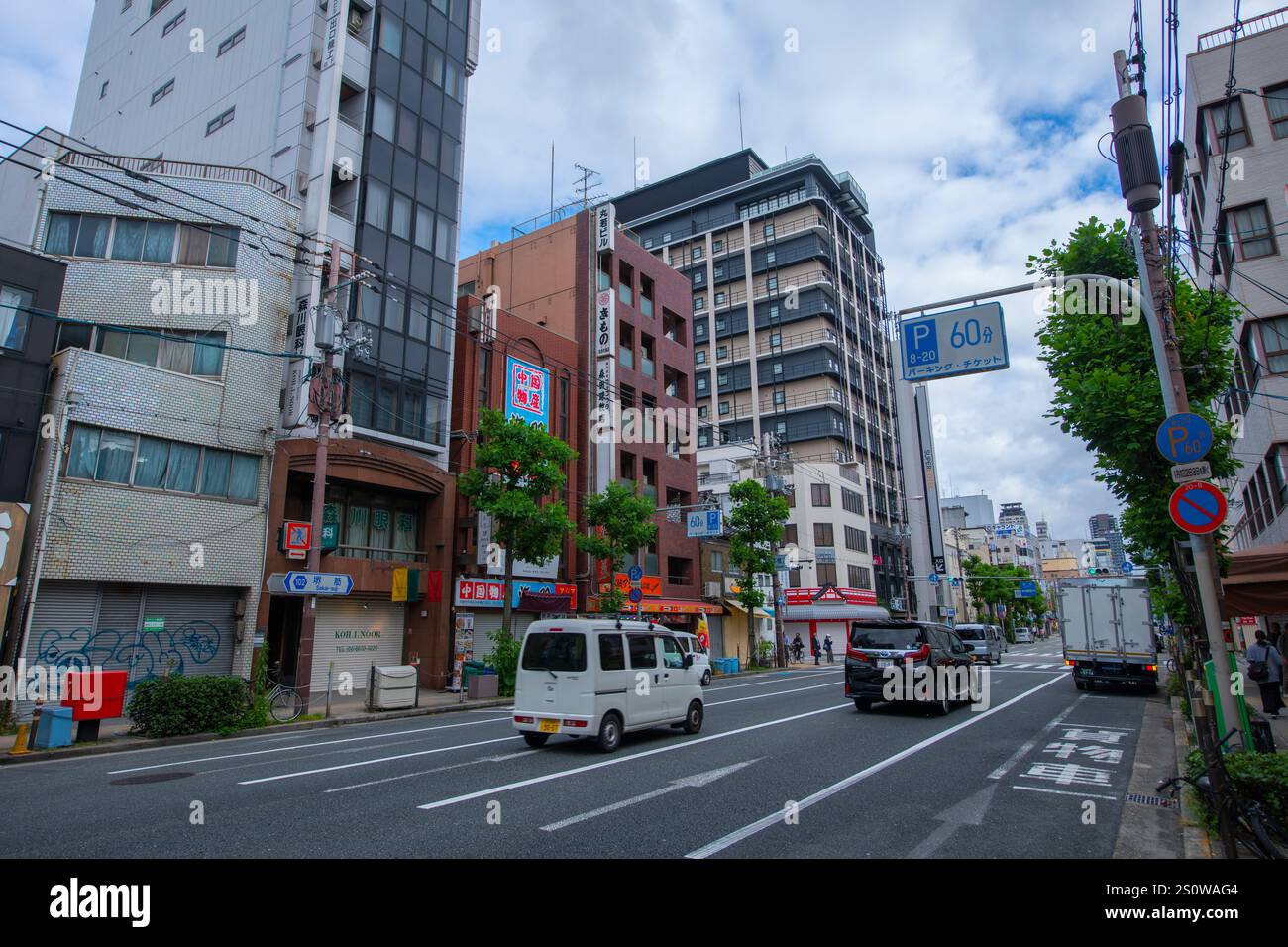 Modern commercial buildings on Sakai suji Avenue at Nipponbashi in ...
