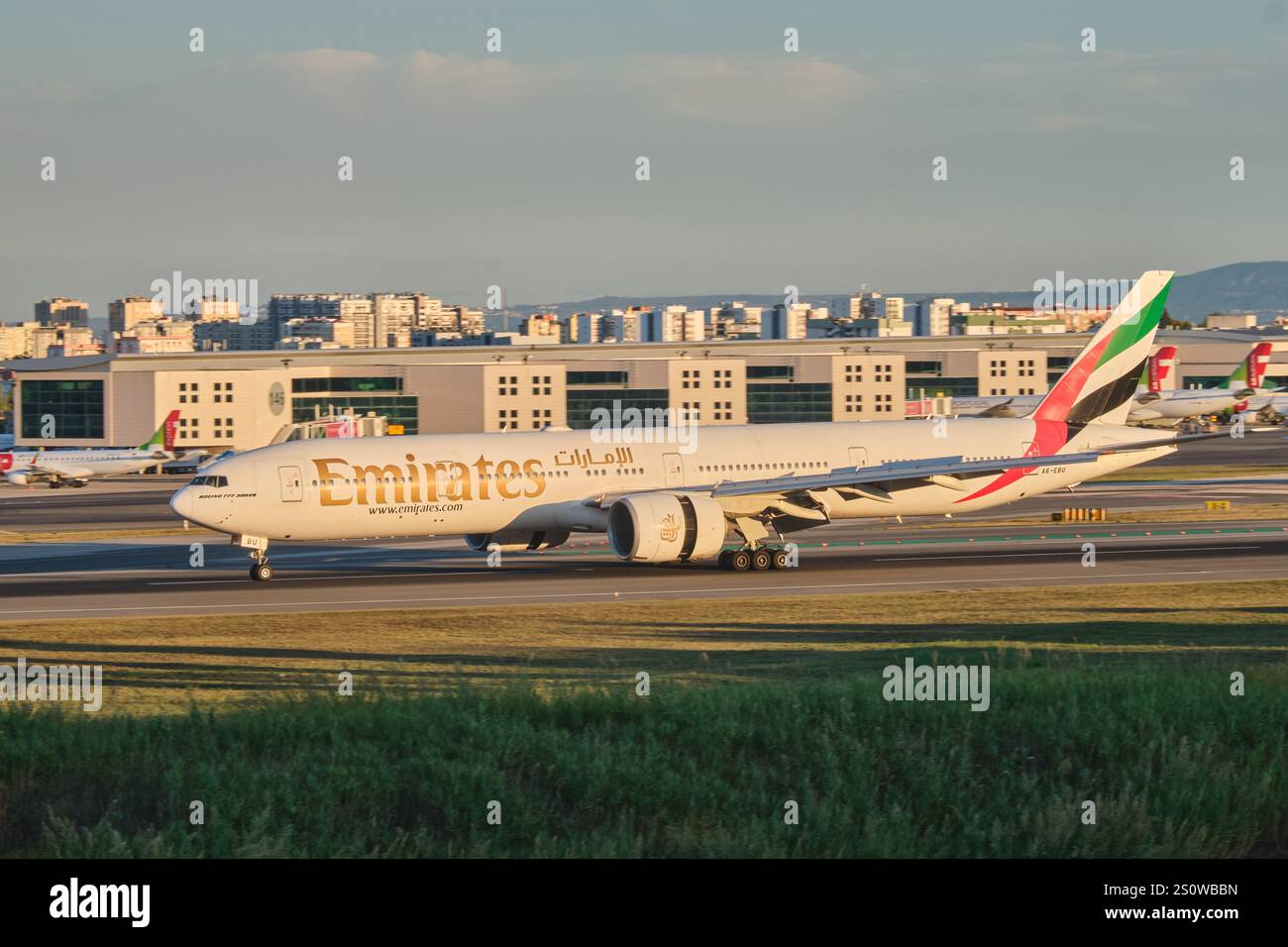 Emirates Boeing 777-31H passenger plane taxi on runway in Humberto ...
