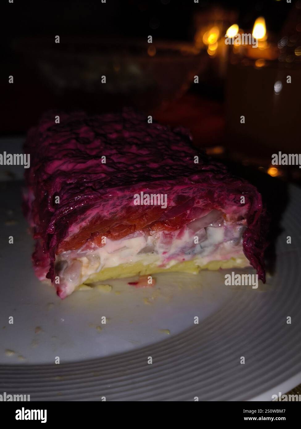 Traditional layered dressed herring salad, also known as sled' pod ...