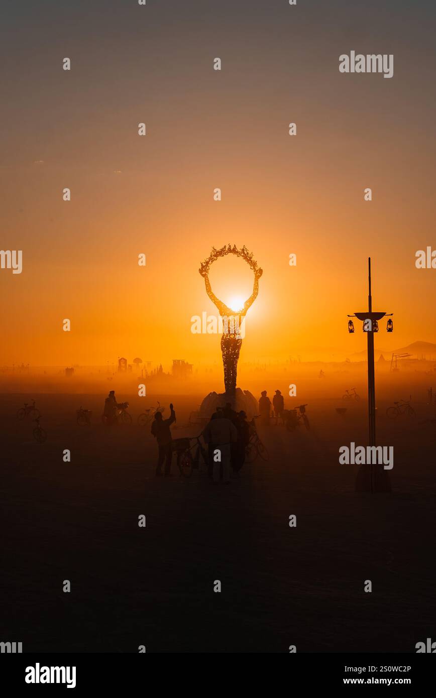 Desert Festival Art Installation Silhouetted Against Vibrant Sunset ...