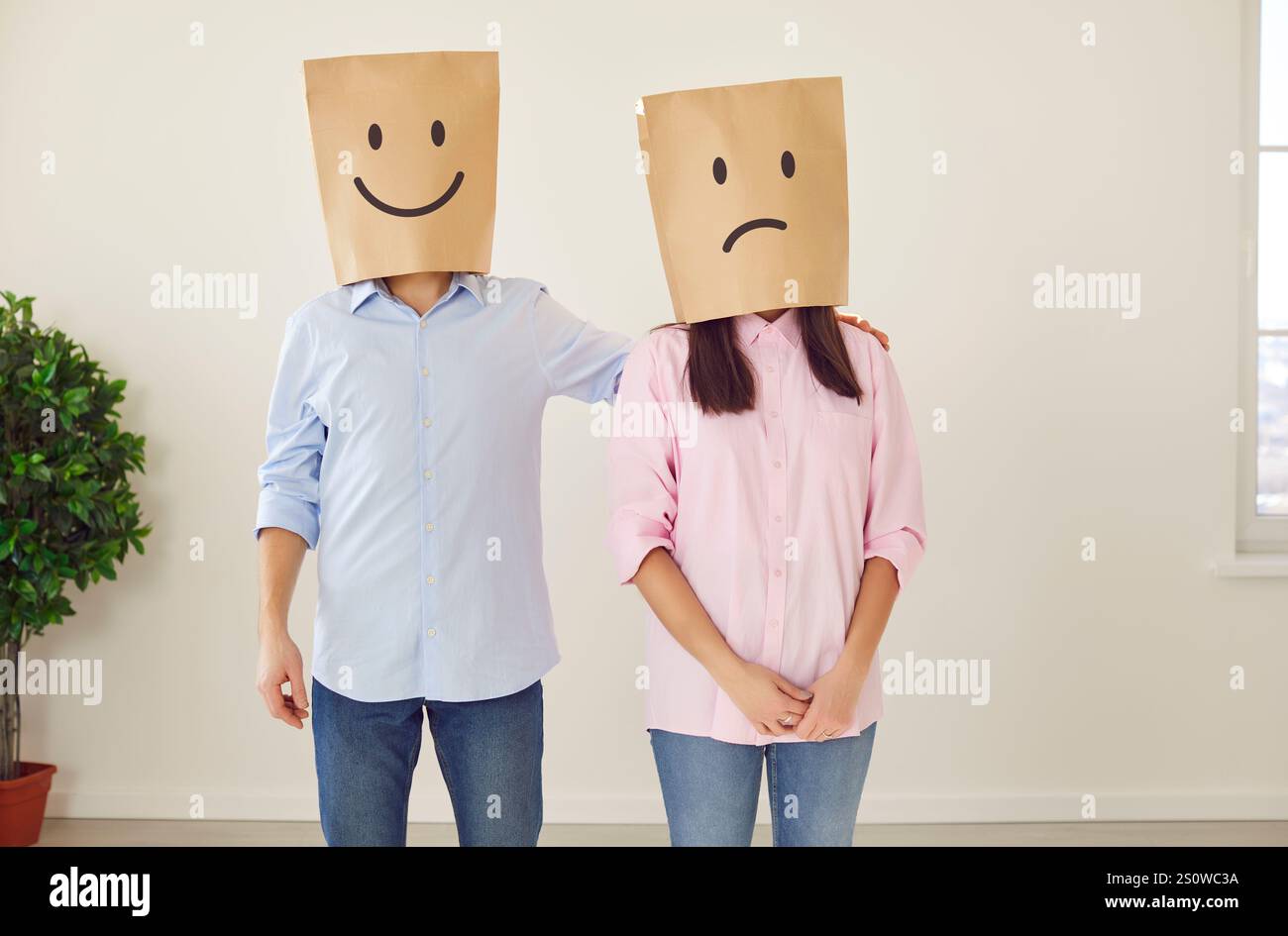 Love couple stand together paper bags on heads emotions happy and ...
