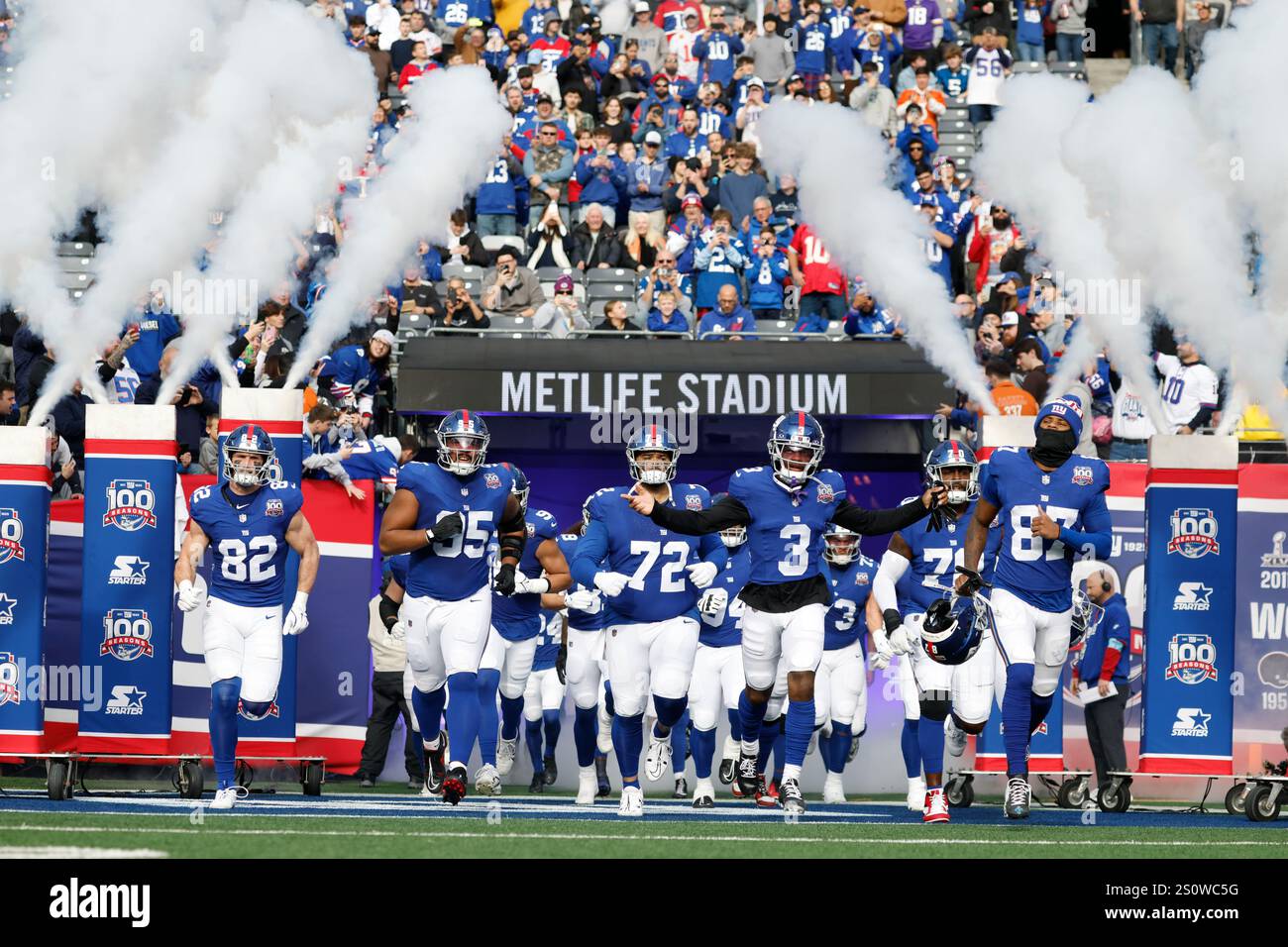 New York Giants players take the field before an NFL football game ...
