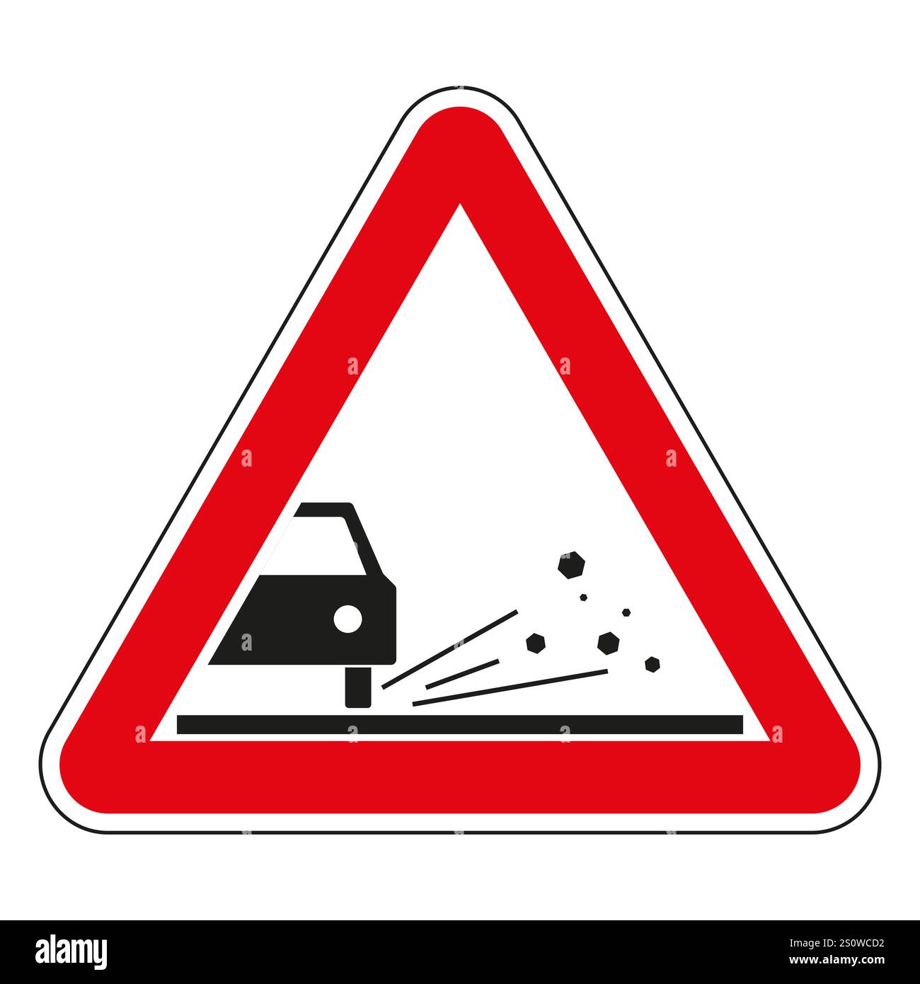 Red triangular road sign warning of loose road surface with gravel or ...