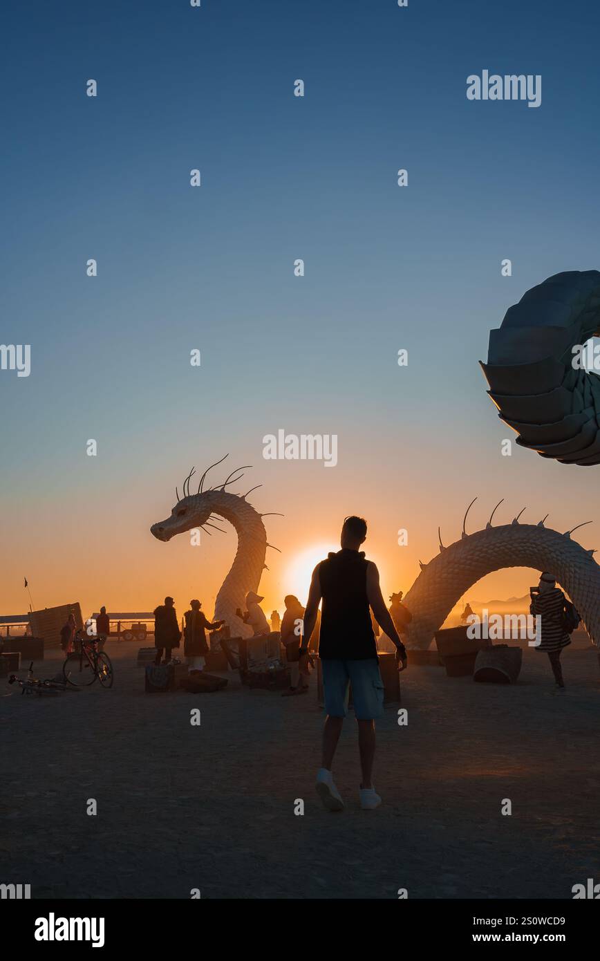 A large dragon like sculpture made of metallic segments stands in a ...