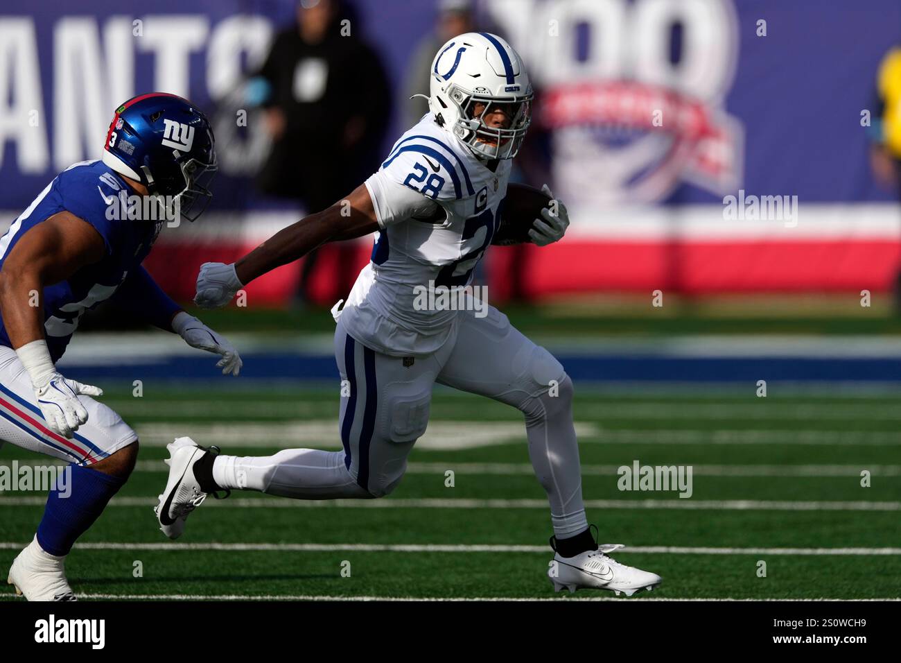 Indianapolis Colts running back Jonathan Taylor (28) tries to get past ...