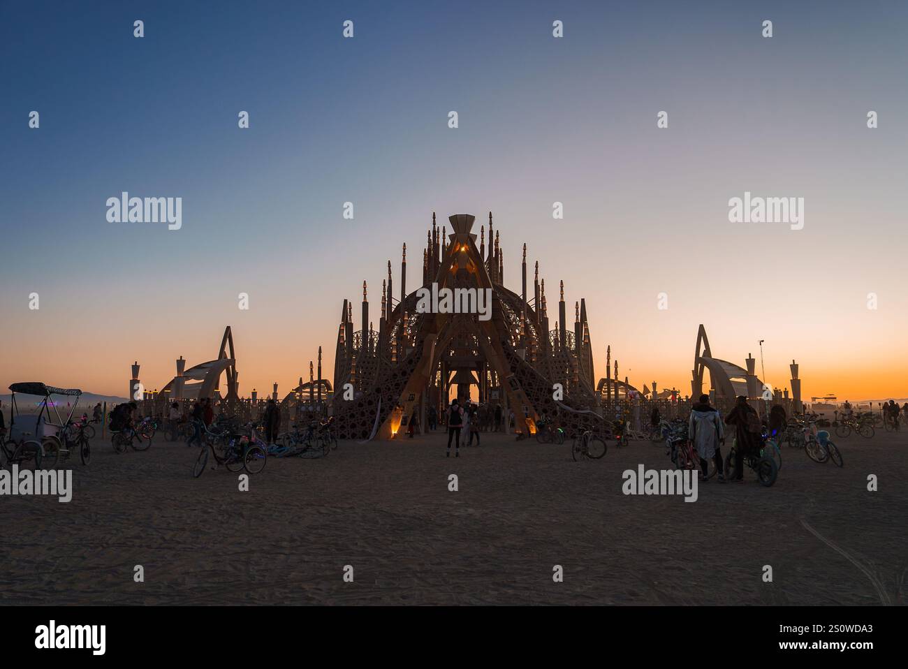 Intricate Wooden Structure at Burning Man Festival in Desert Sunset ...