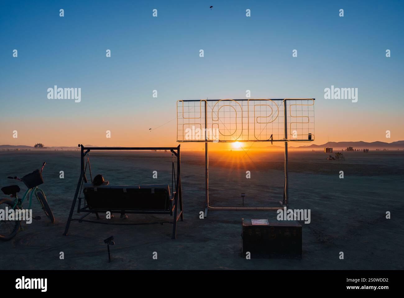 Desert Sunrise with HOPE Art Installation and Swing Set Stock Photo - Alamy