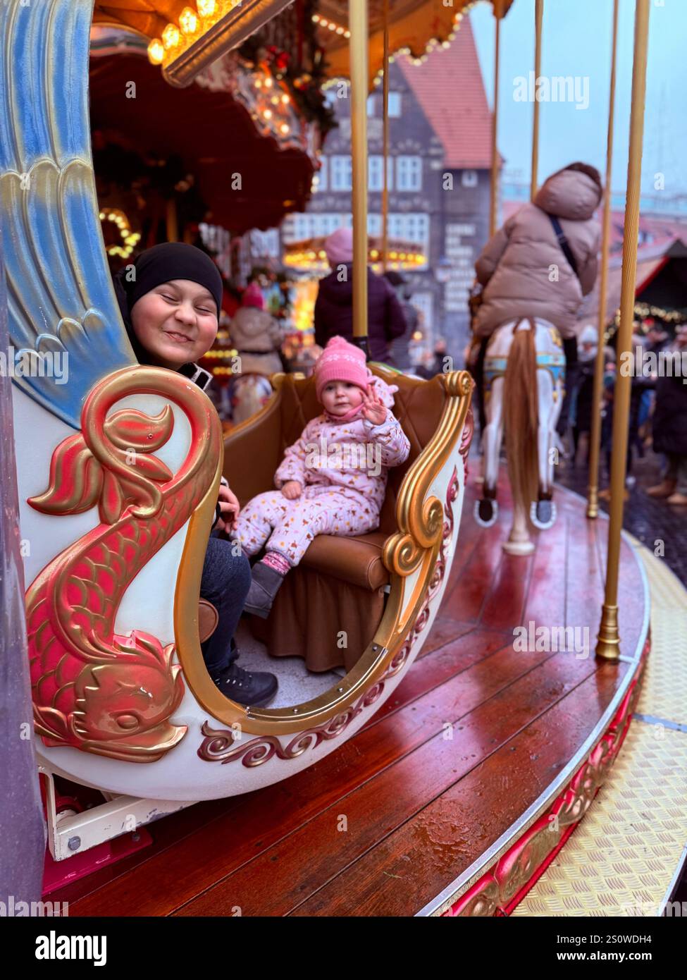 Carousel with horses in a children's amusement park. High quality photo ...