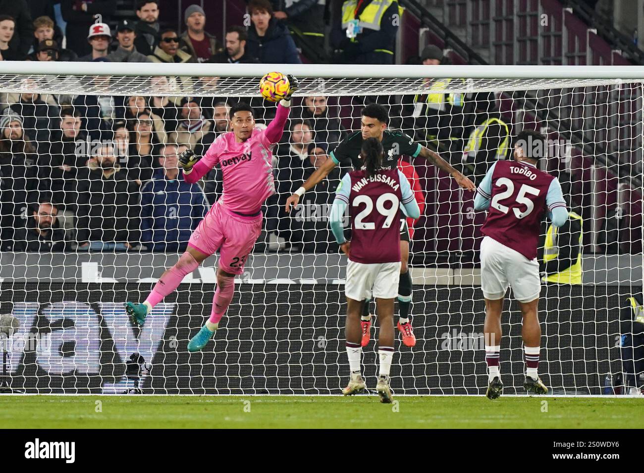 West Ham United goalkeeper Alphonse Areola defends the ball in the area ...