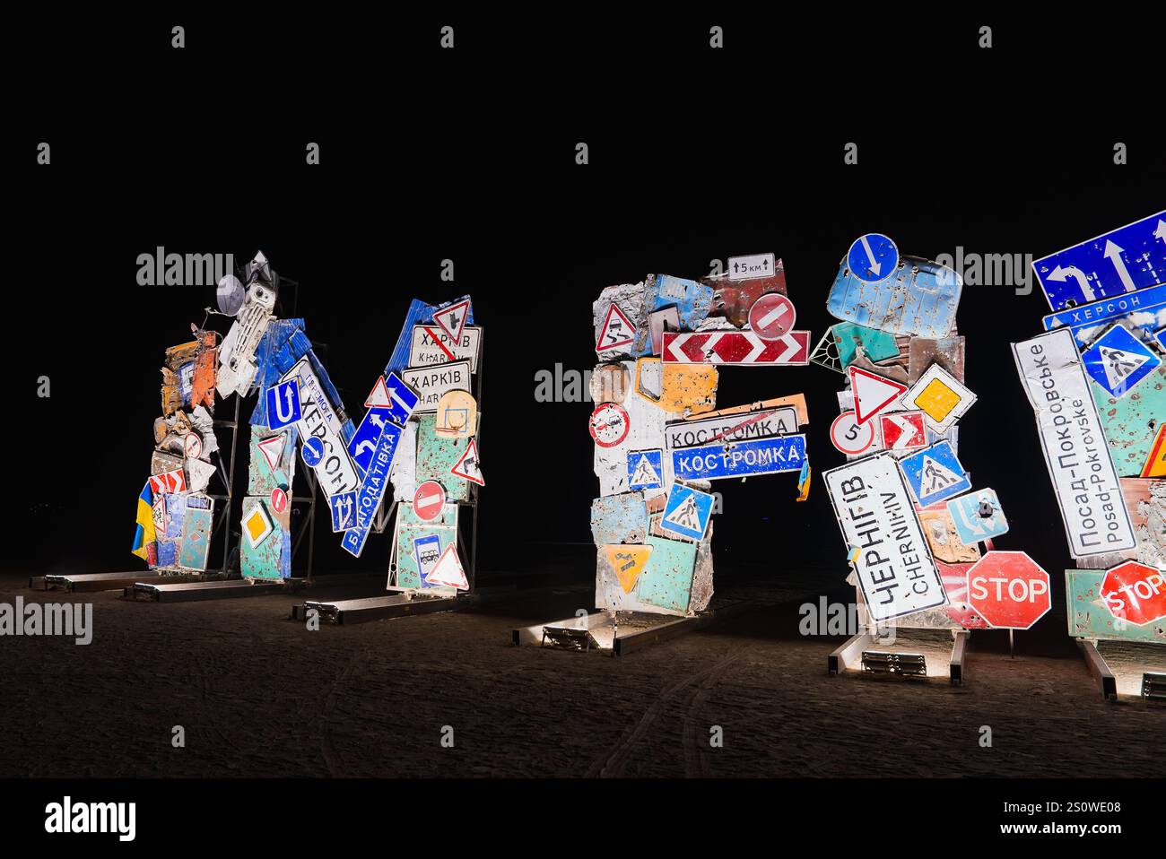 Illuminated Art Installation of Cyrillic Road Signs in Desert Night ...